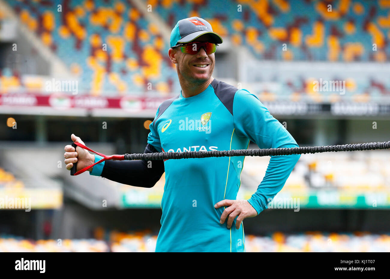 Australia's David Warner warms up during a nets session at The Gabba ...