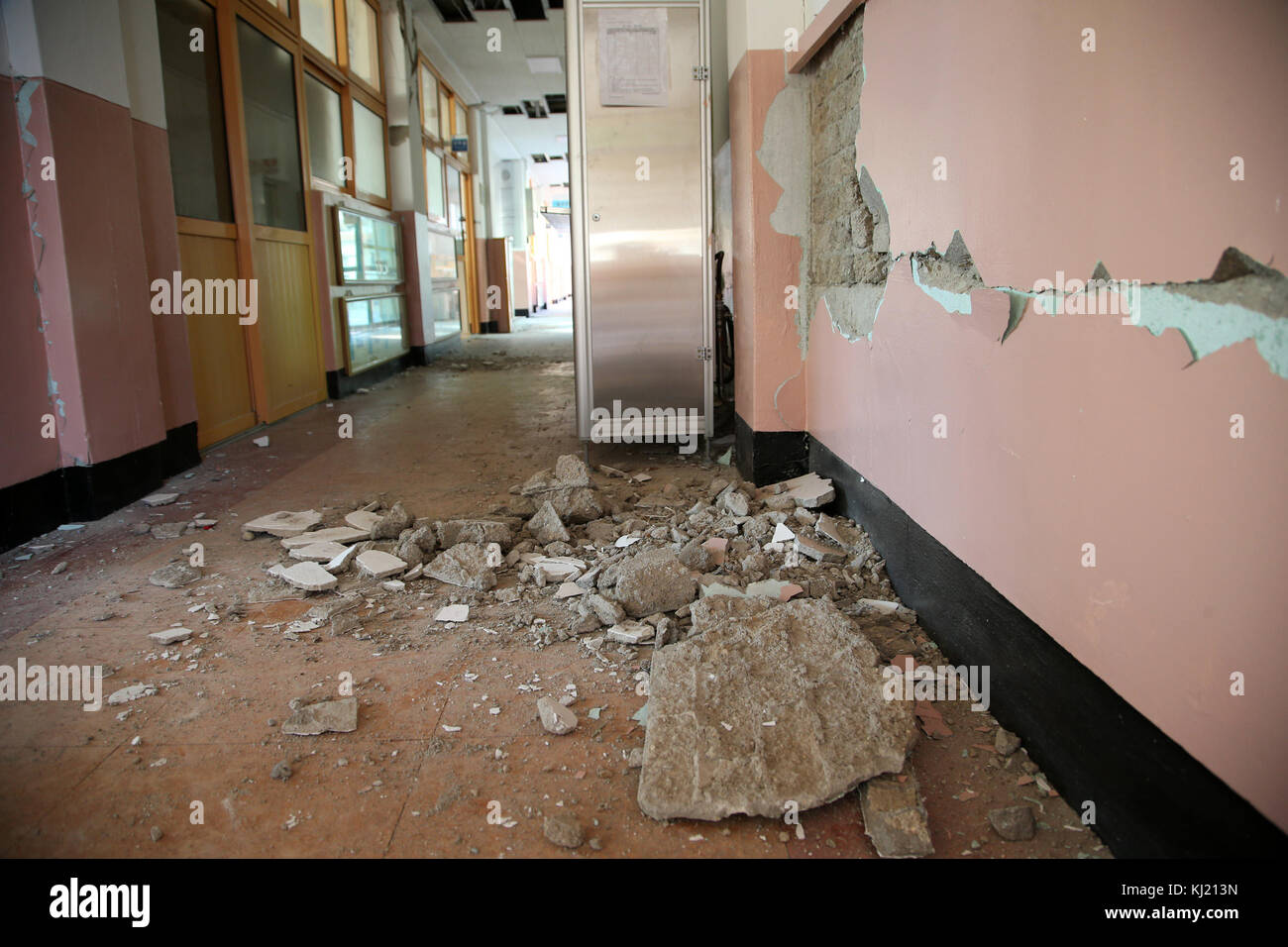 21st Nov, 2017. Fallen wall A wall has been damaged at an elementary ...