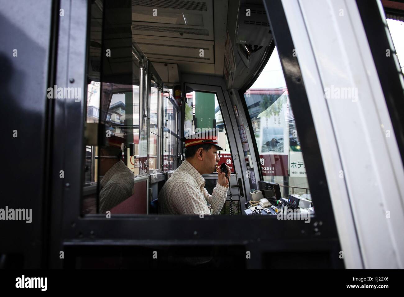 Hakone, Japan. 21st Nov, 2017. Train conductor, speaking through his ...