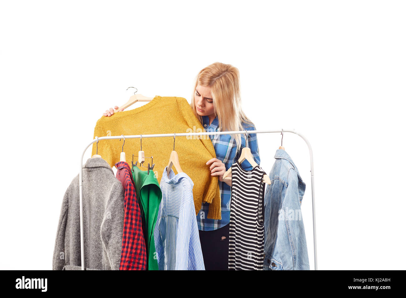 Browsing through clothes Stock Photo - Alamy