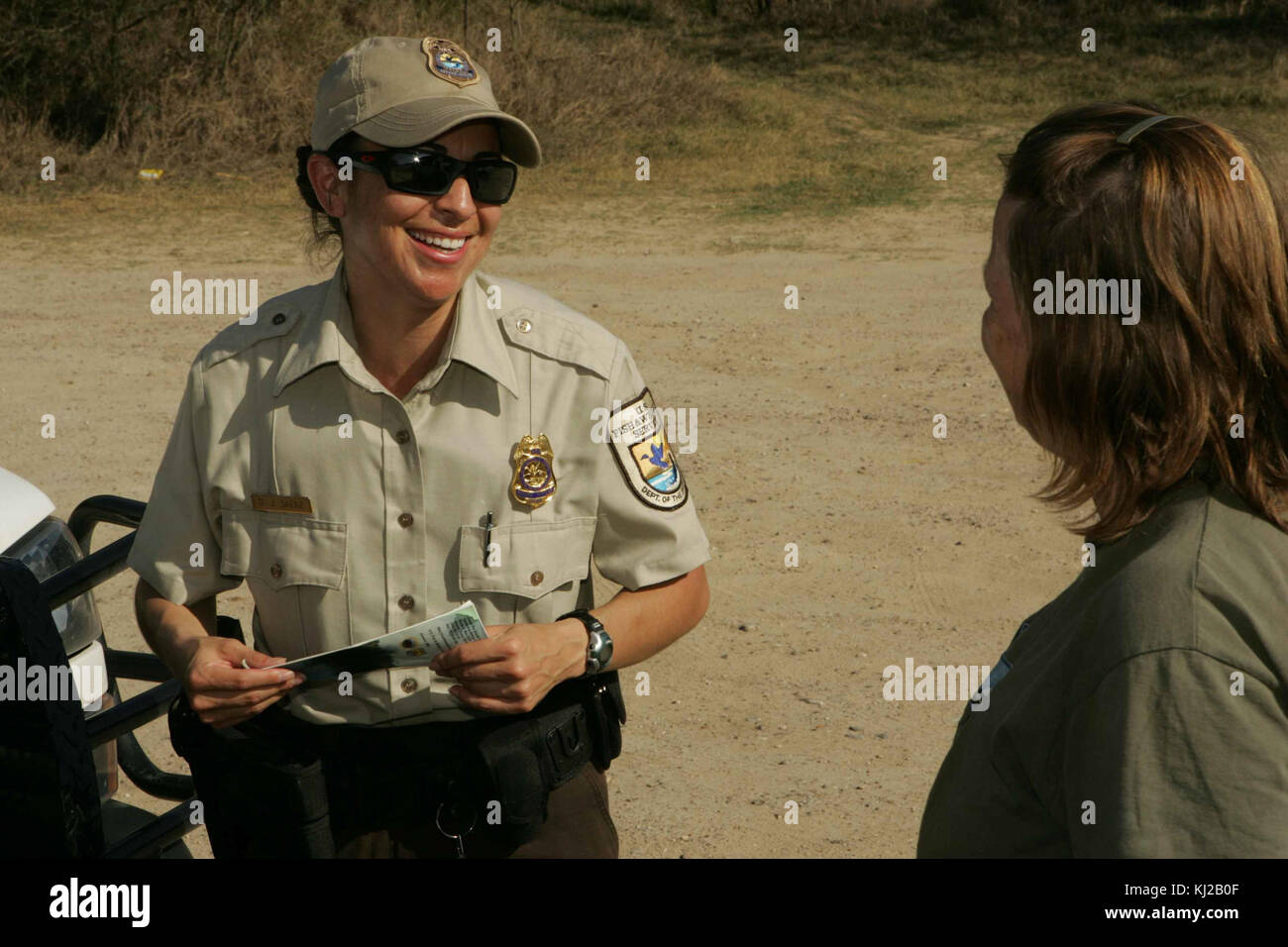 Officer speaks with a visitor Stock Photo - Alamy