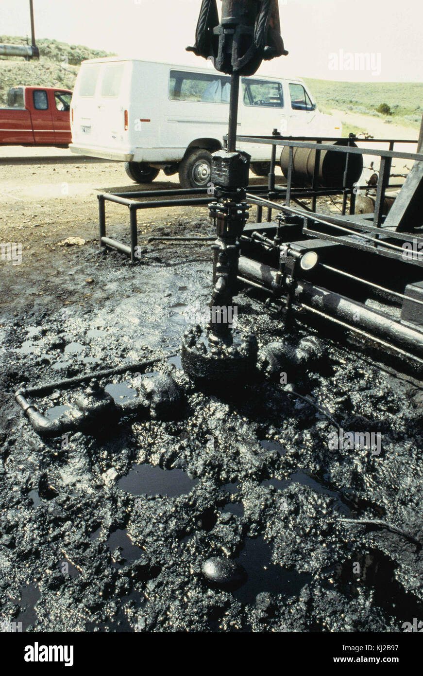 Oil well head and surrounding oil pollution on ground Stock Photo - Alamy