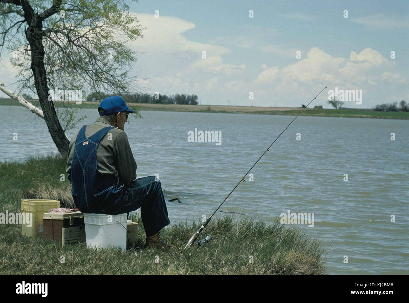 Old man fishing Stock Photo - Alamy