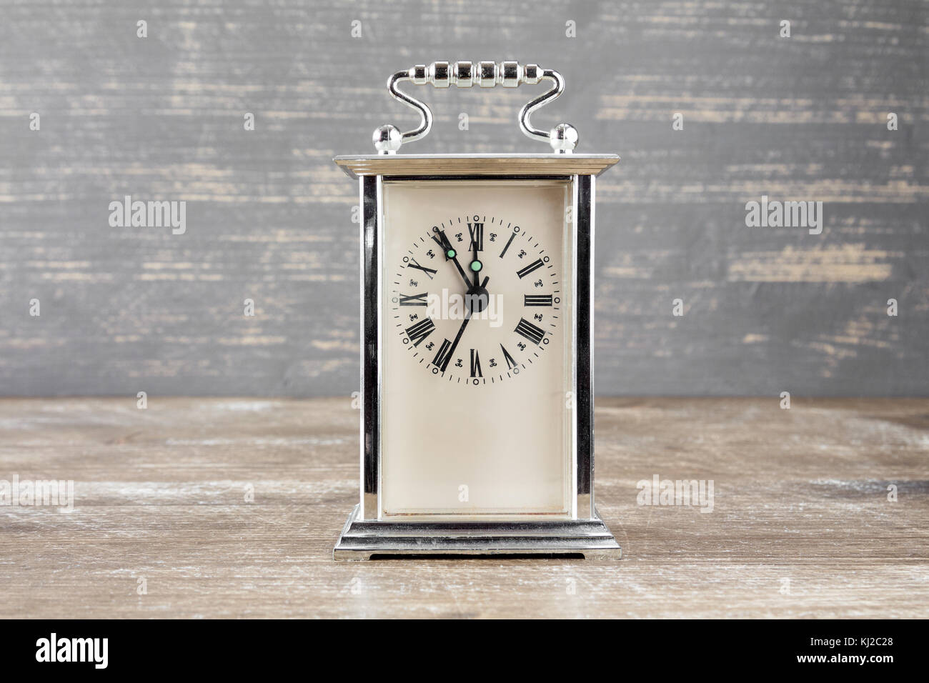Old vintage analogue clock on wood background Stock Photo - Alamy