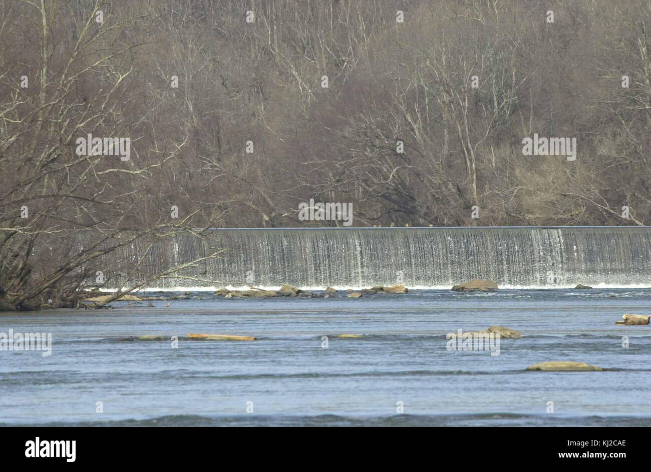 The artificial dam on this river is a man-made structure designed to ...