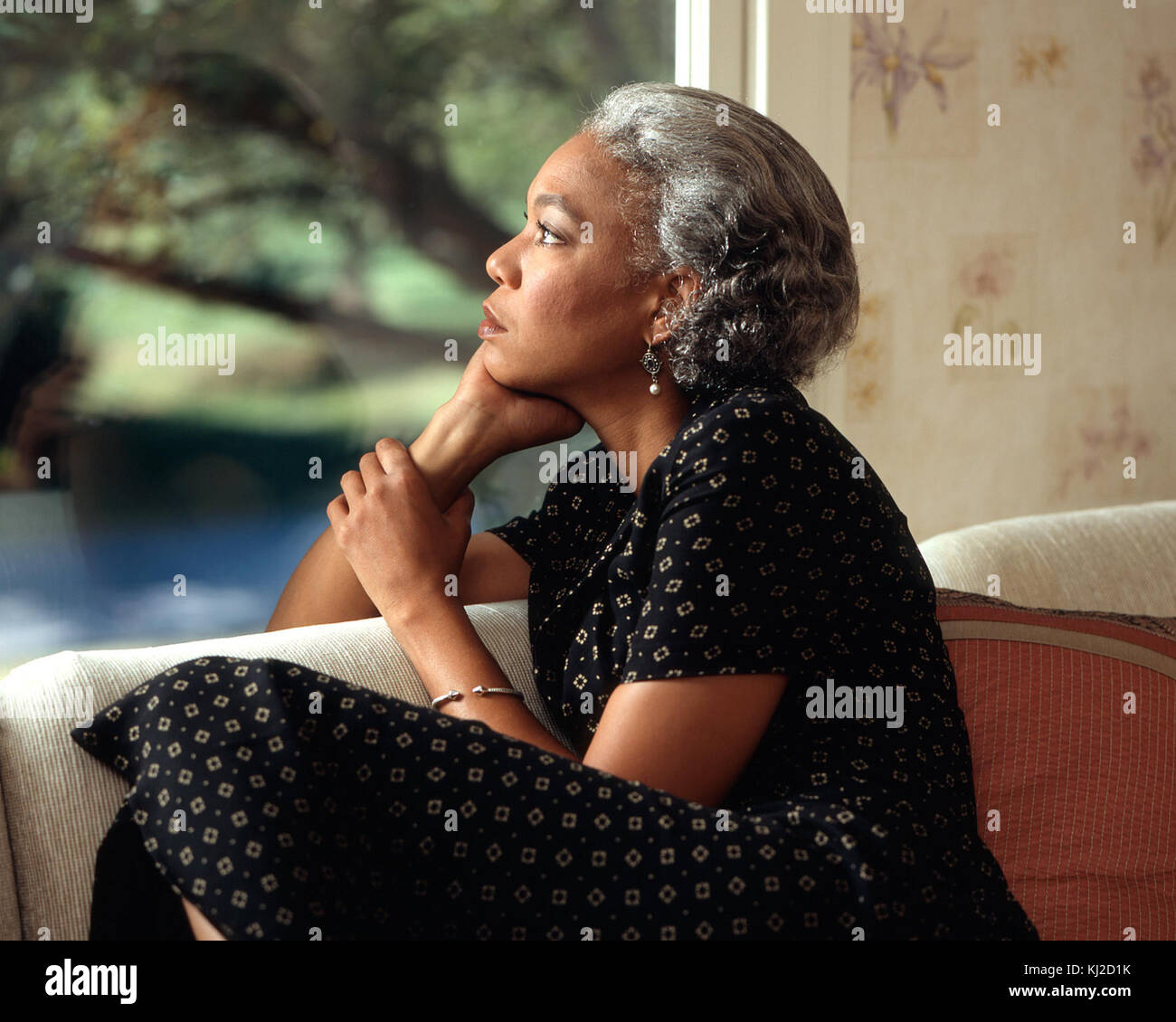 Woman staring out window (4 Stock Photo - Alamy