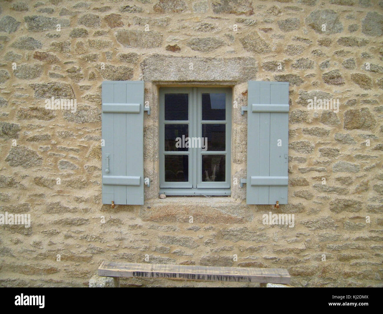 Antique windows on stone house Stock Photo - Alamy
