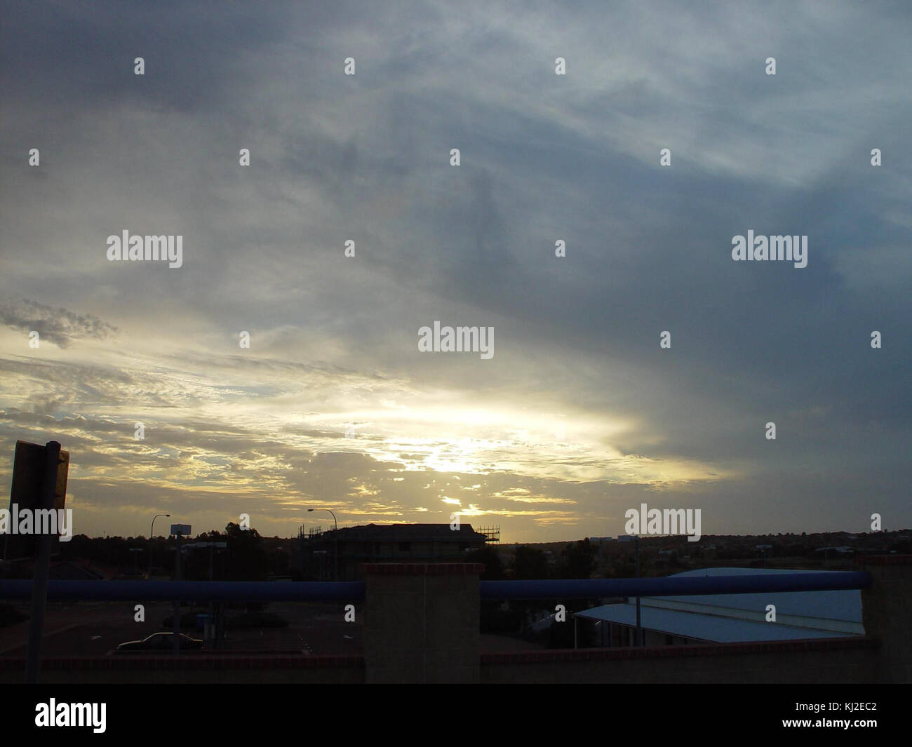 Bright pre sunset sky glow over burns beach Stock Photo - Alamy