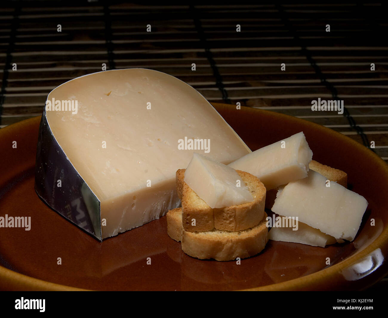 This photograph depicts a close-up of a cheese product, identified as ...