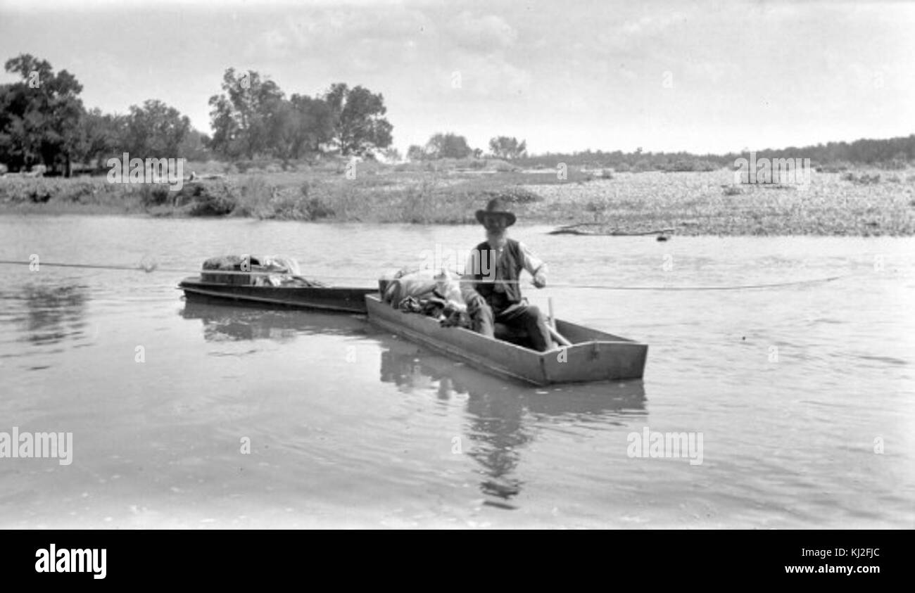 Elderly man crossing a body of water Stock Photo - Alamy