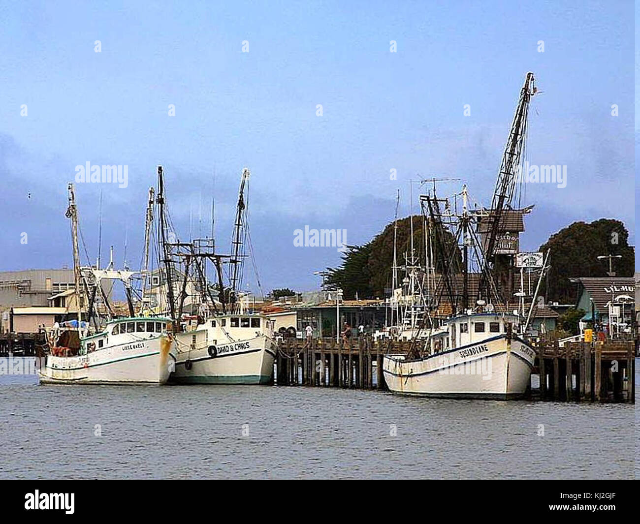 Fishing boats piers docks ocean Stock Photo - Alamy
