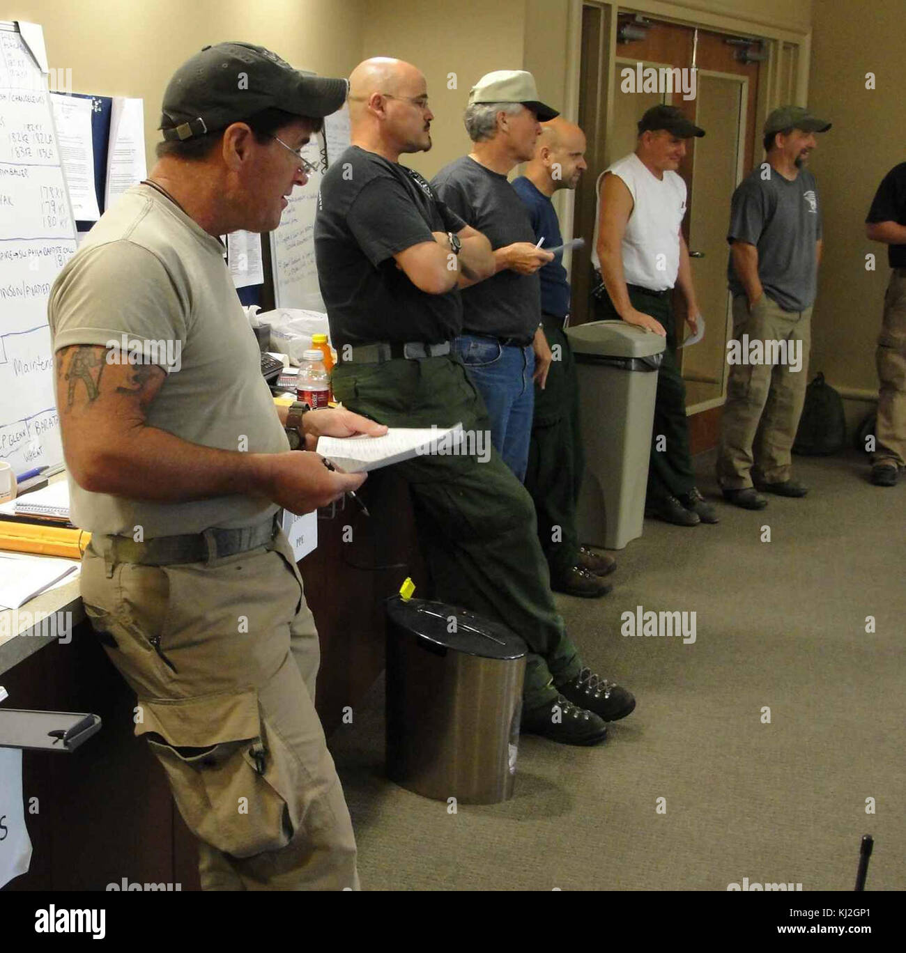 Personnel in office at morning briefing Stock Photo - Alamy