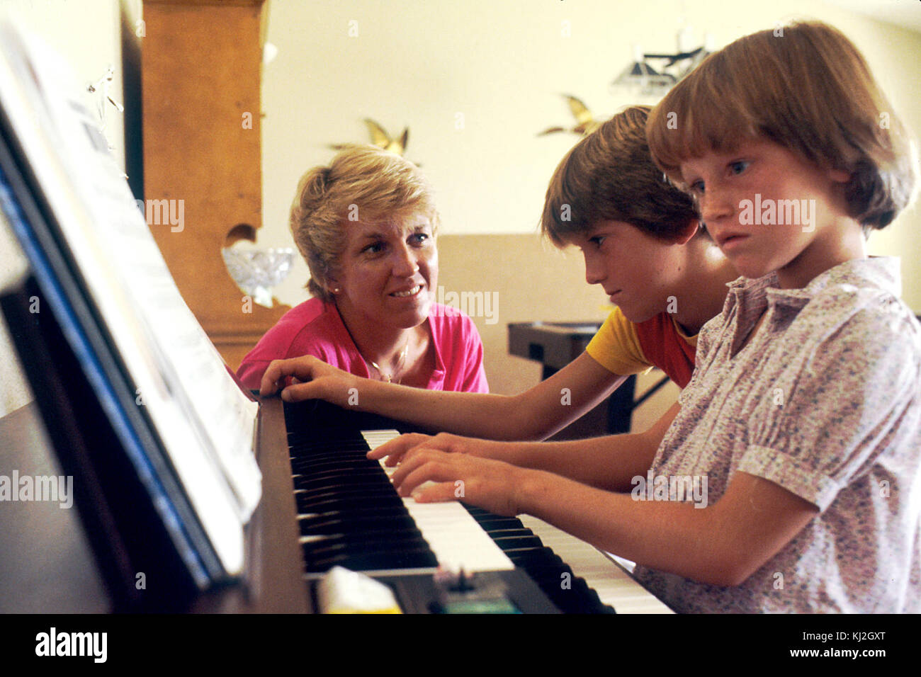 Girl playing an organ Stock Photo - Alamy