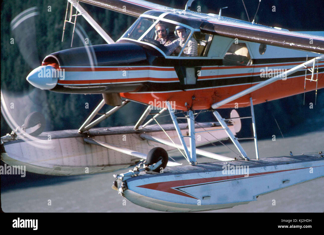 Pilot and co pilot flying the plane Stock Photo - Alamy