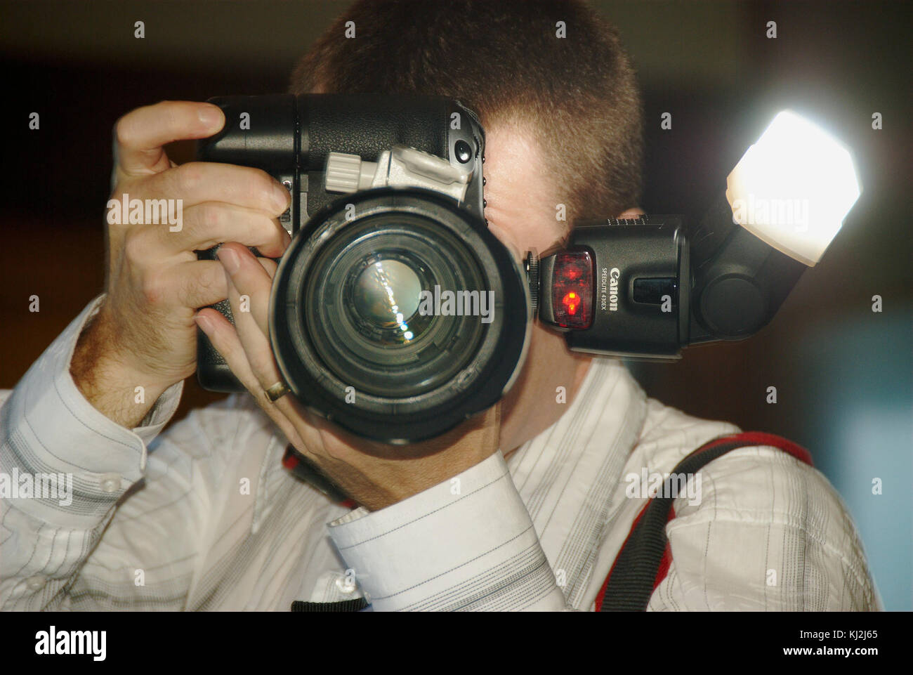 Photographer caught in action Stock Photo - Alamy