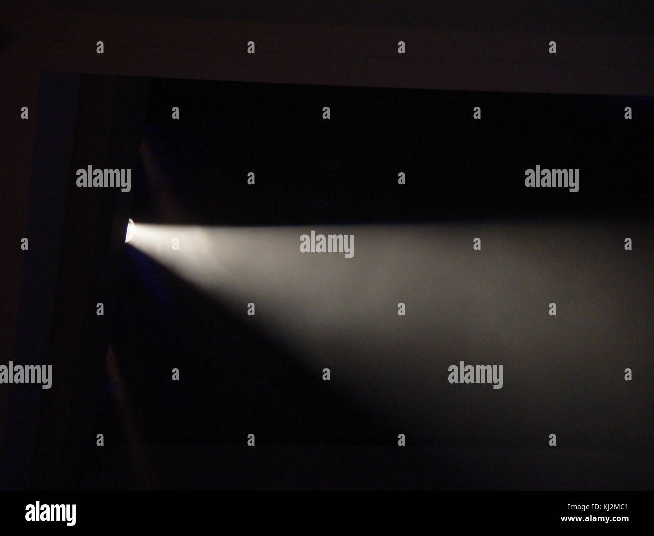 Pin spot spotlight against dark background Stock Photo - Alamy