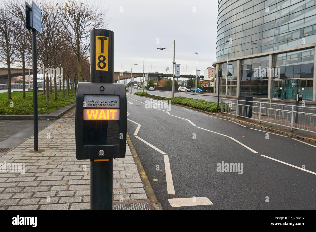 An electronic display informing pedestrians to WAIT before crossing the ...