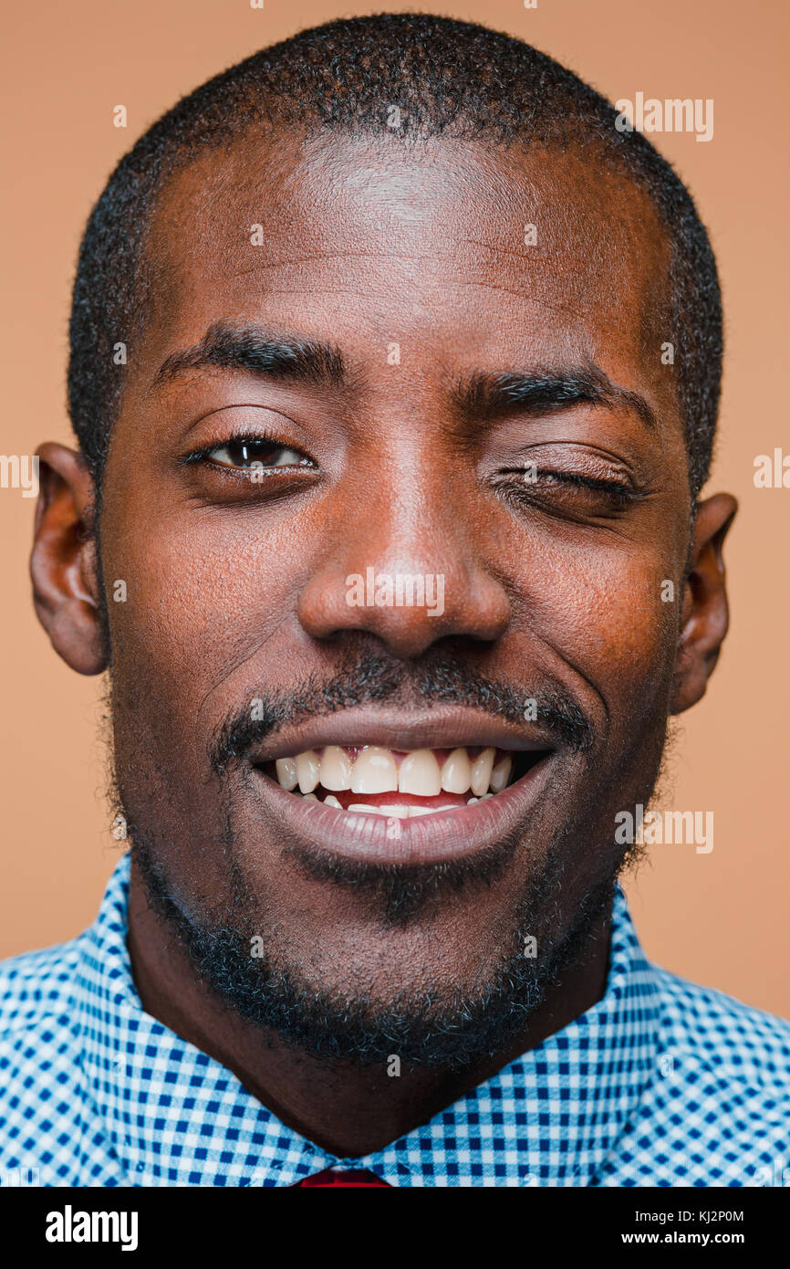 Black male afro portrait smiling studio hi-res stock photography and ...