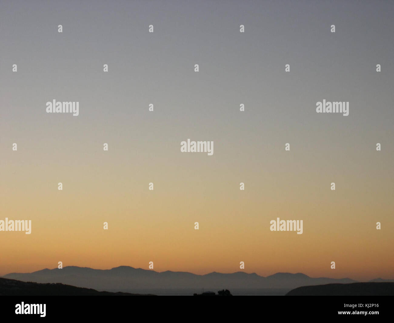 Photograph capturing the sky's color gradient at dusk as the sun sets ...