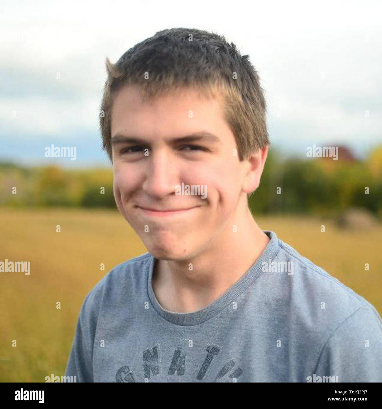 Young man with dimples Stock Photo - Alamy