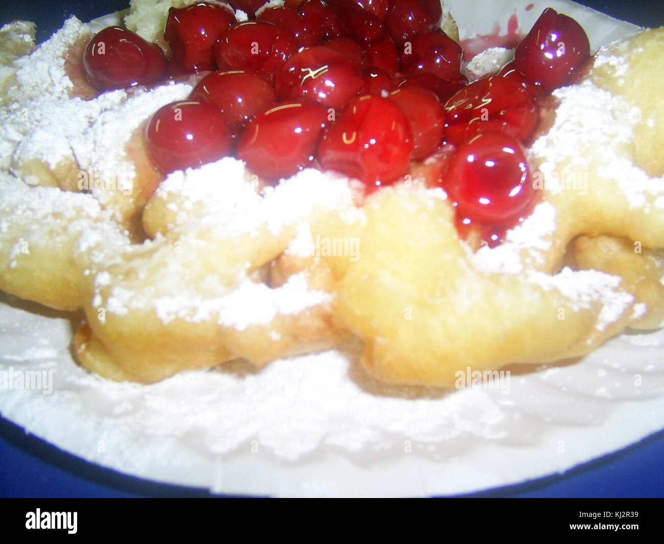 Closeup on all American cherry funnel cake Stock Photo - Alamy