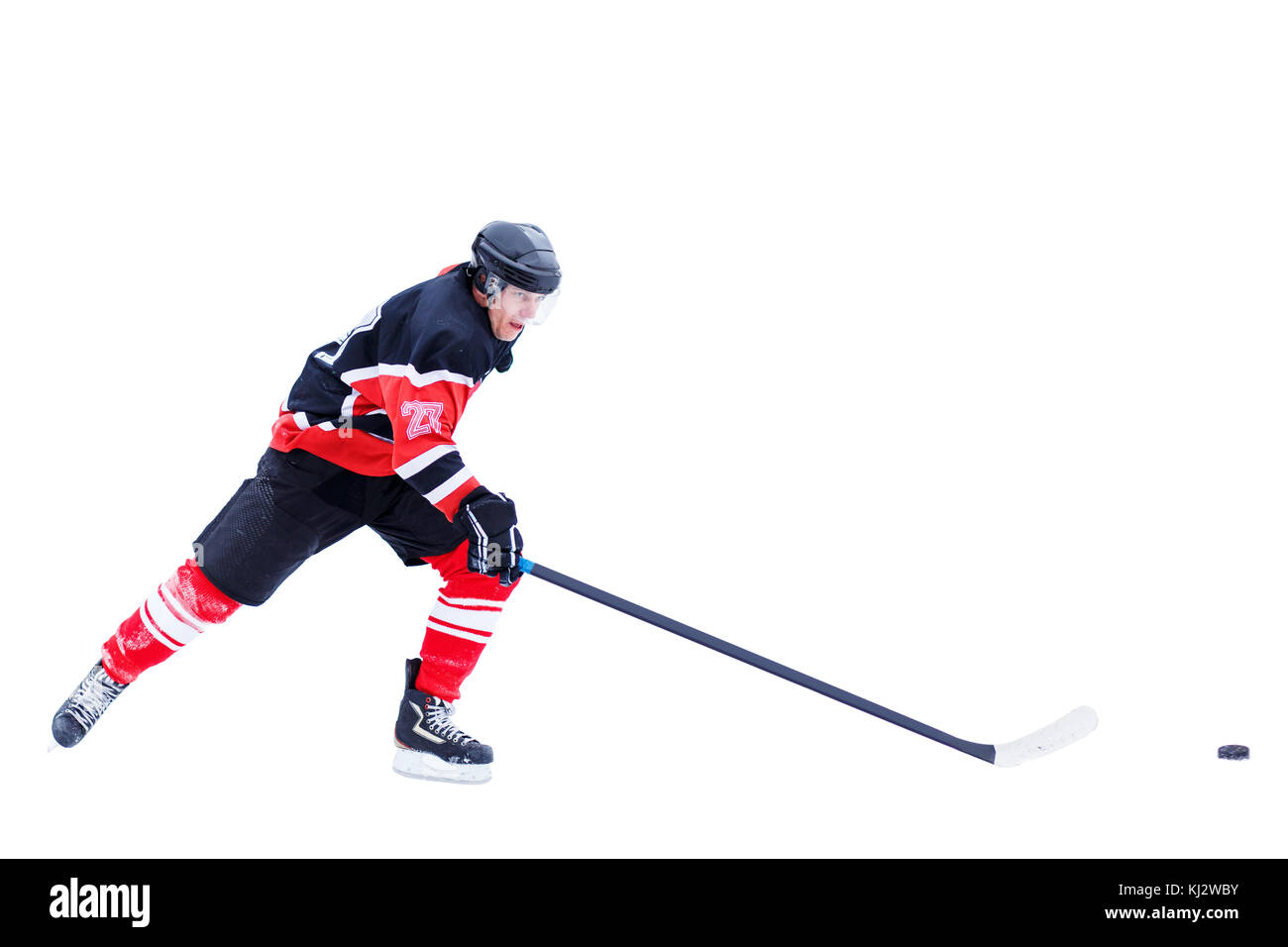 Ice hockey skater in attack isolated on white background Stock Photo ...