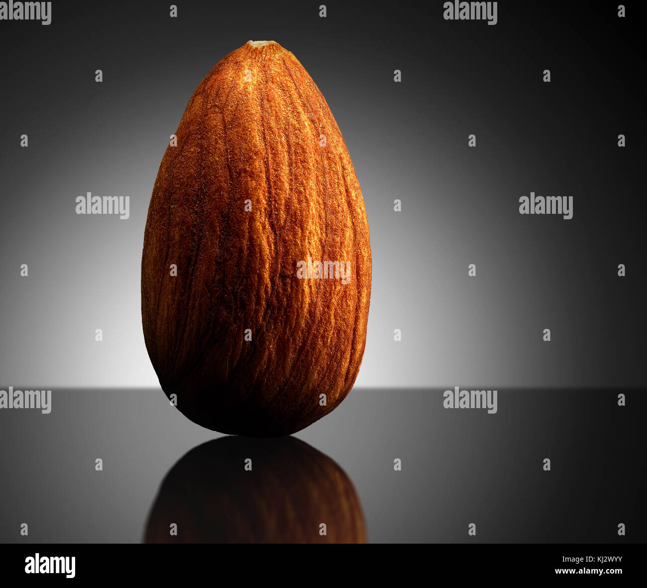 Almond on black background. Close-up or macro Stock Photo - Alamy