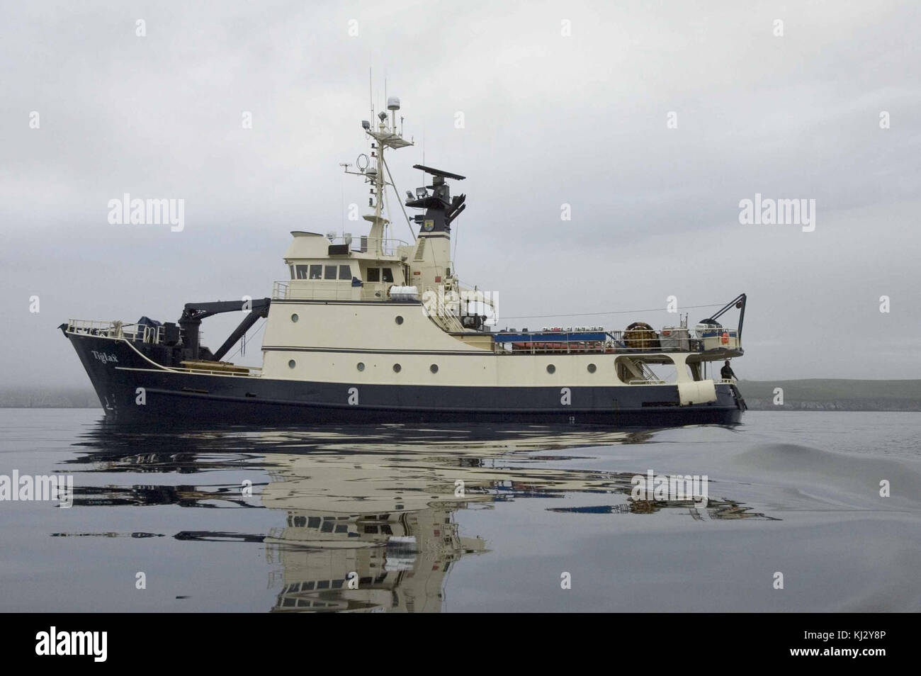 Ship in calm waters Stock Photo - Alamy