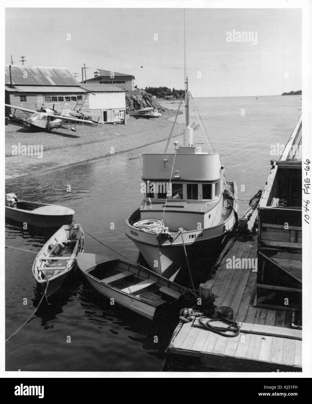 Small ship with boats on water vintage old photography Stock Photo - Alamy
