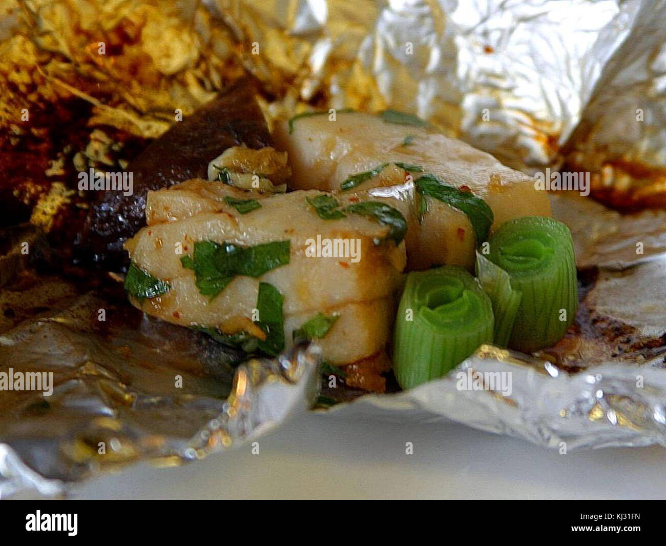 Paper wrapped tuna Stock Photo - Alamy