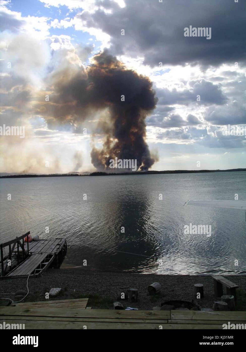 Smoke column above lake Stock Photo - Alamy