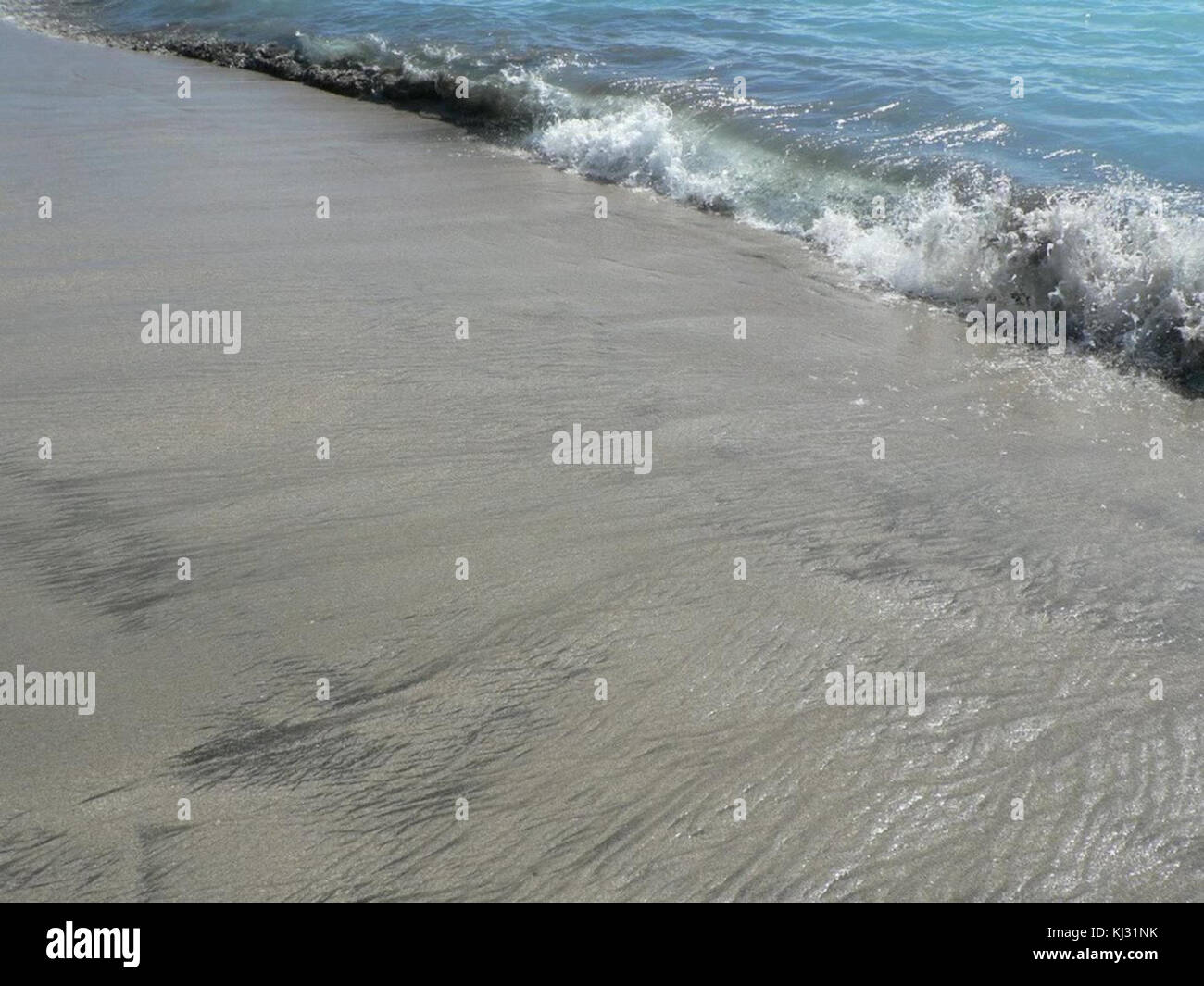 Ocean wave meet sand beach Stock Photo - Alamy