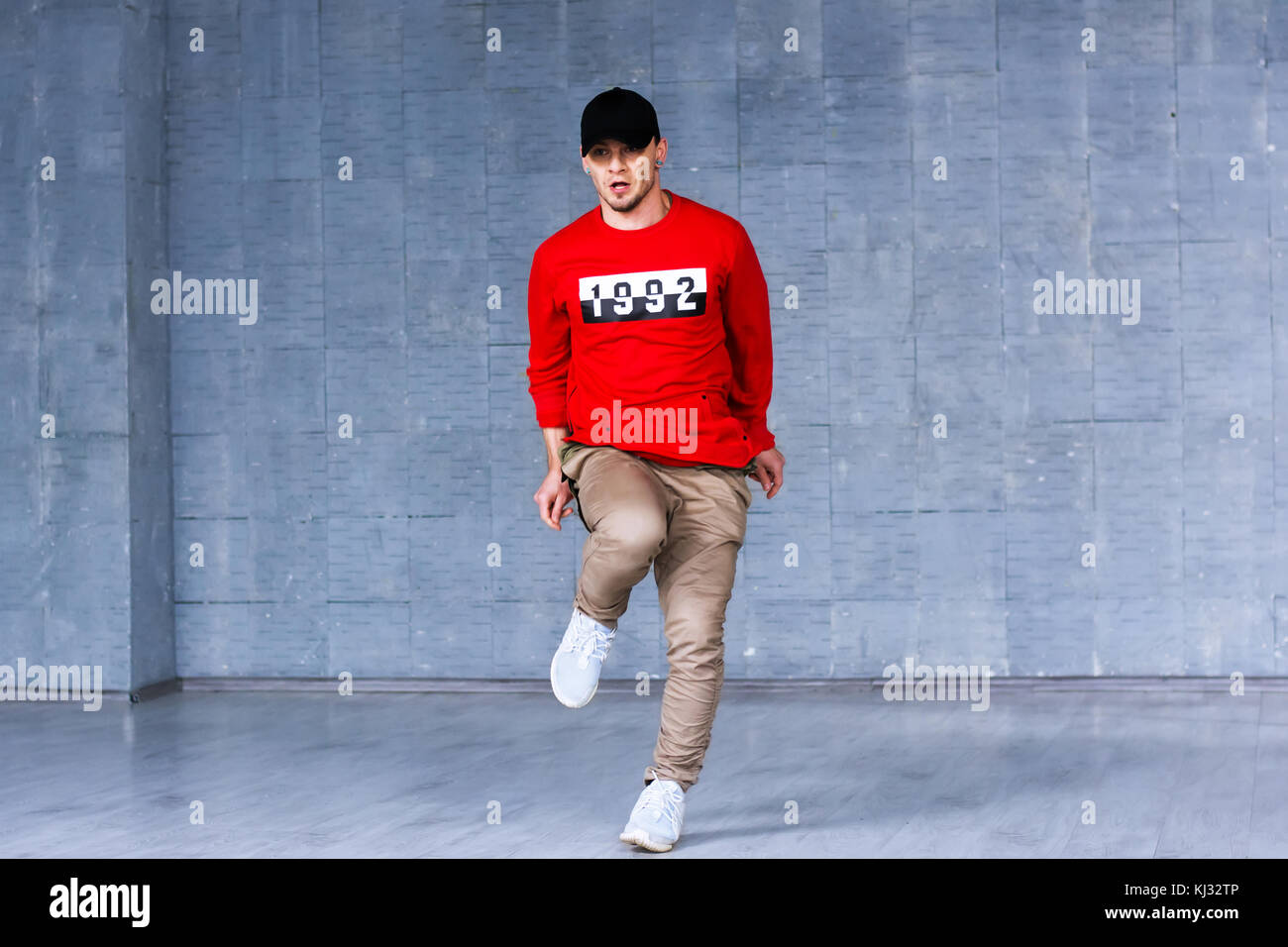 Young handsome rapper in action Stock Photo - Alamy