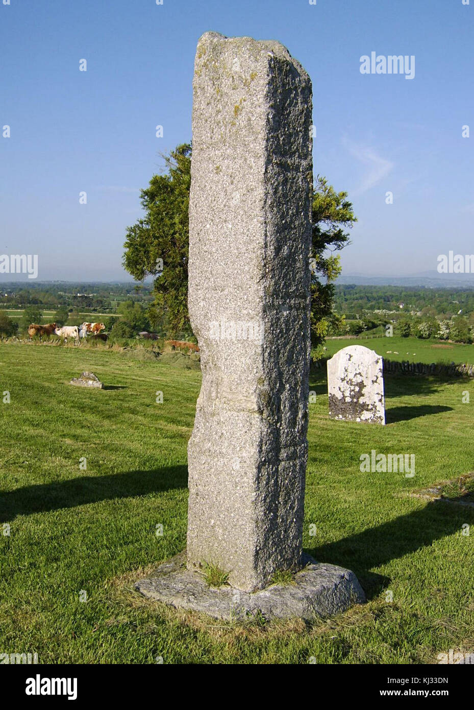 Stone cross on field Stock Photo - Alamy