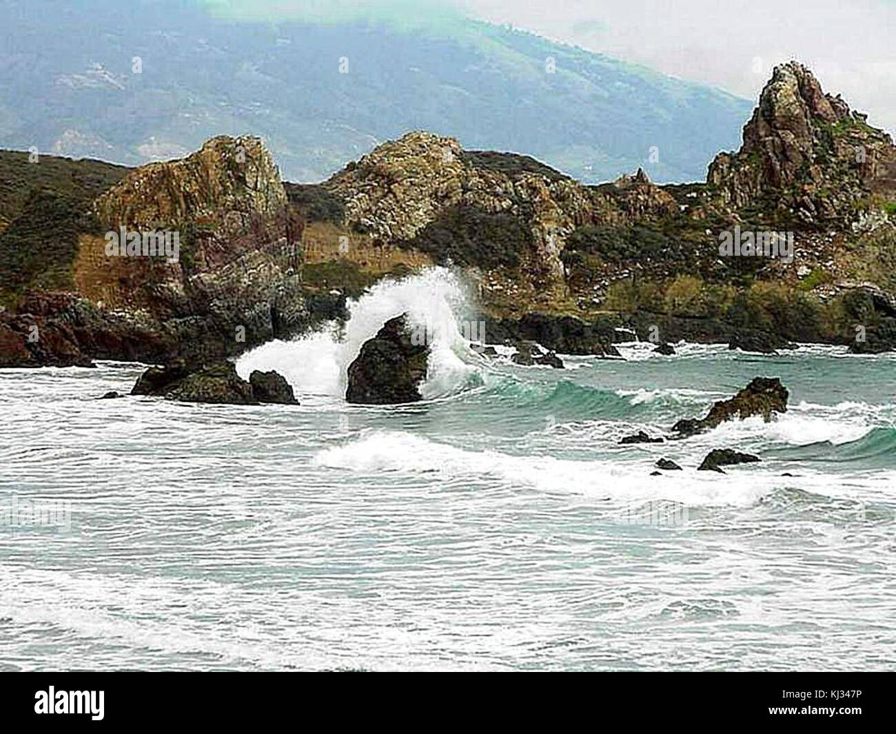 Waves on beach coast Stock Photo - Alamy