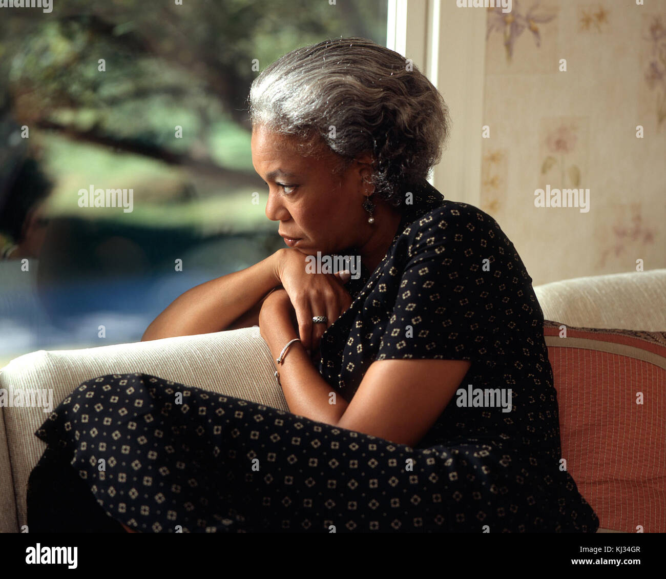 Woman staring out window (3 Stock Photo - Alamy