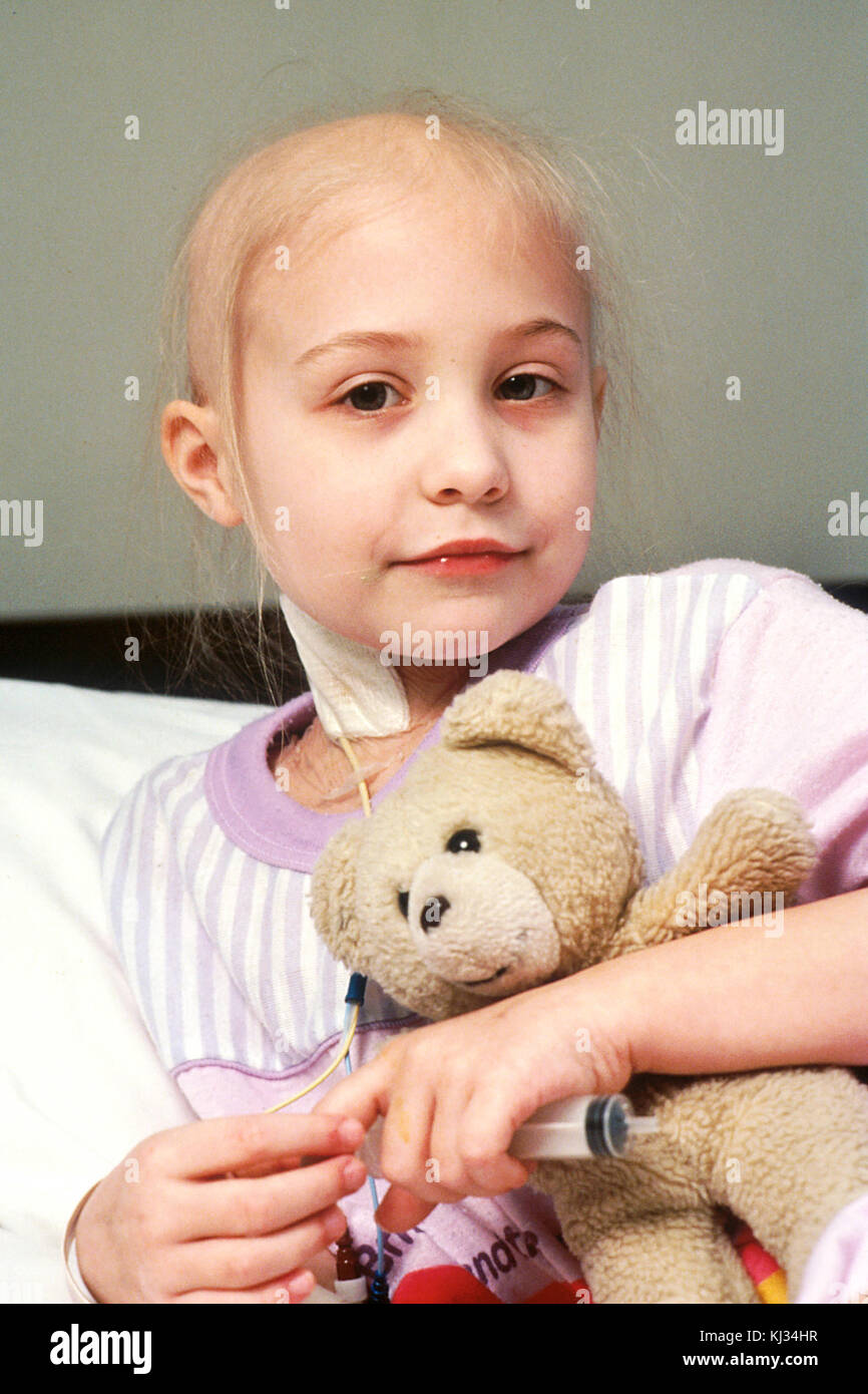 Young patient holds teddy bear Stock Photo - Alamy
