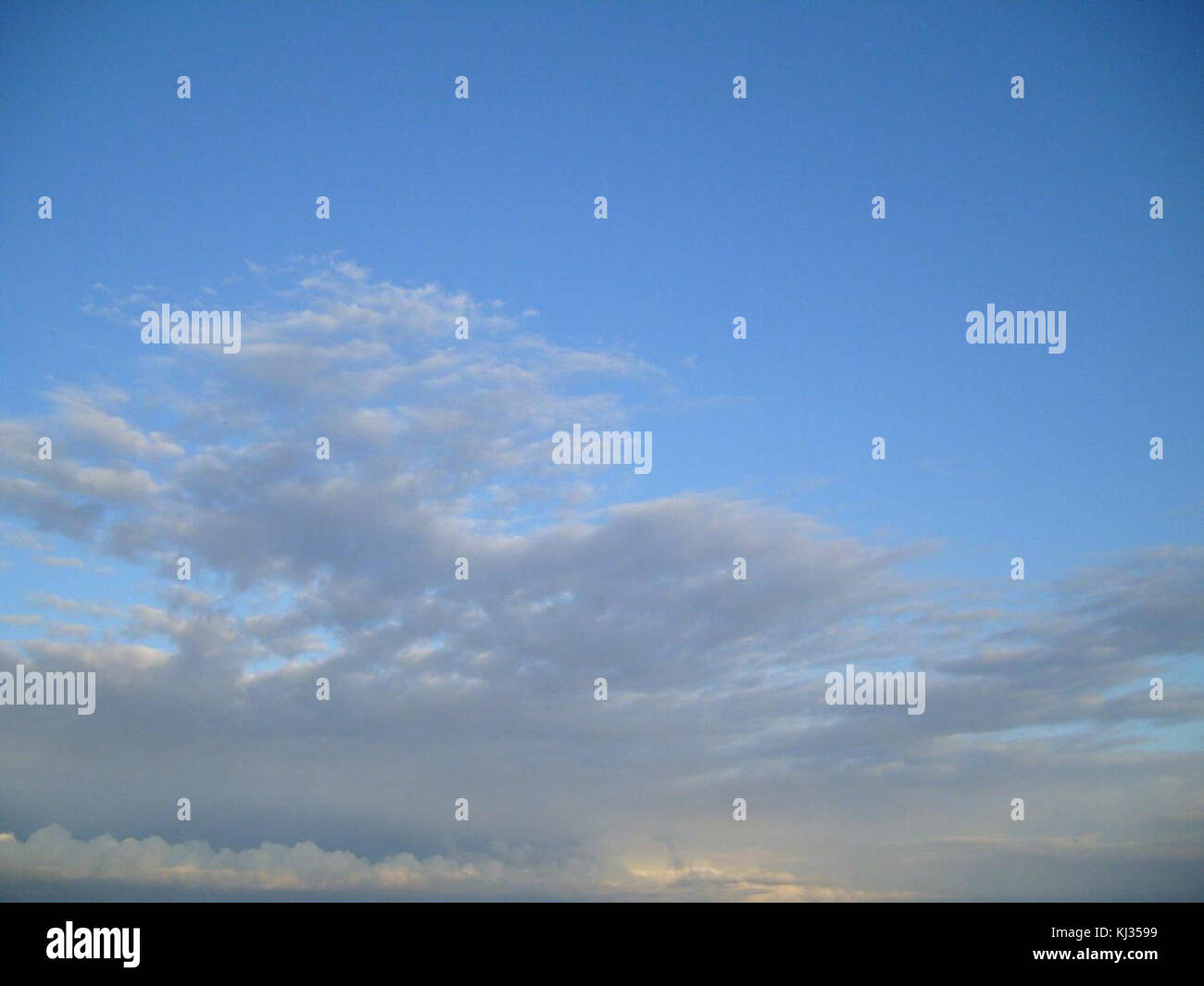 The sky with some clouds is a simple atmospheric observation showing a ...