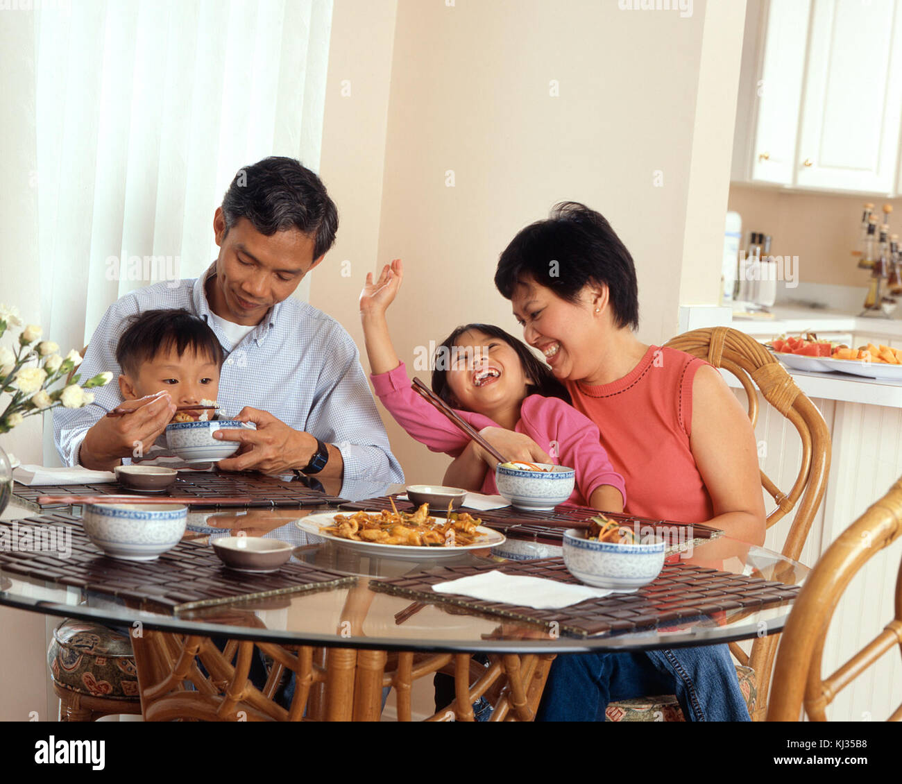 Family eating a meal (2 Stock Photo - Alamy
