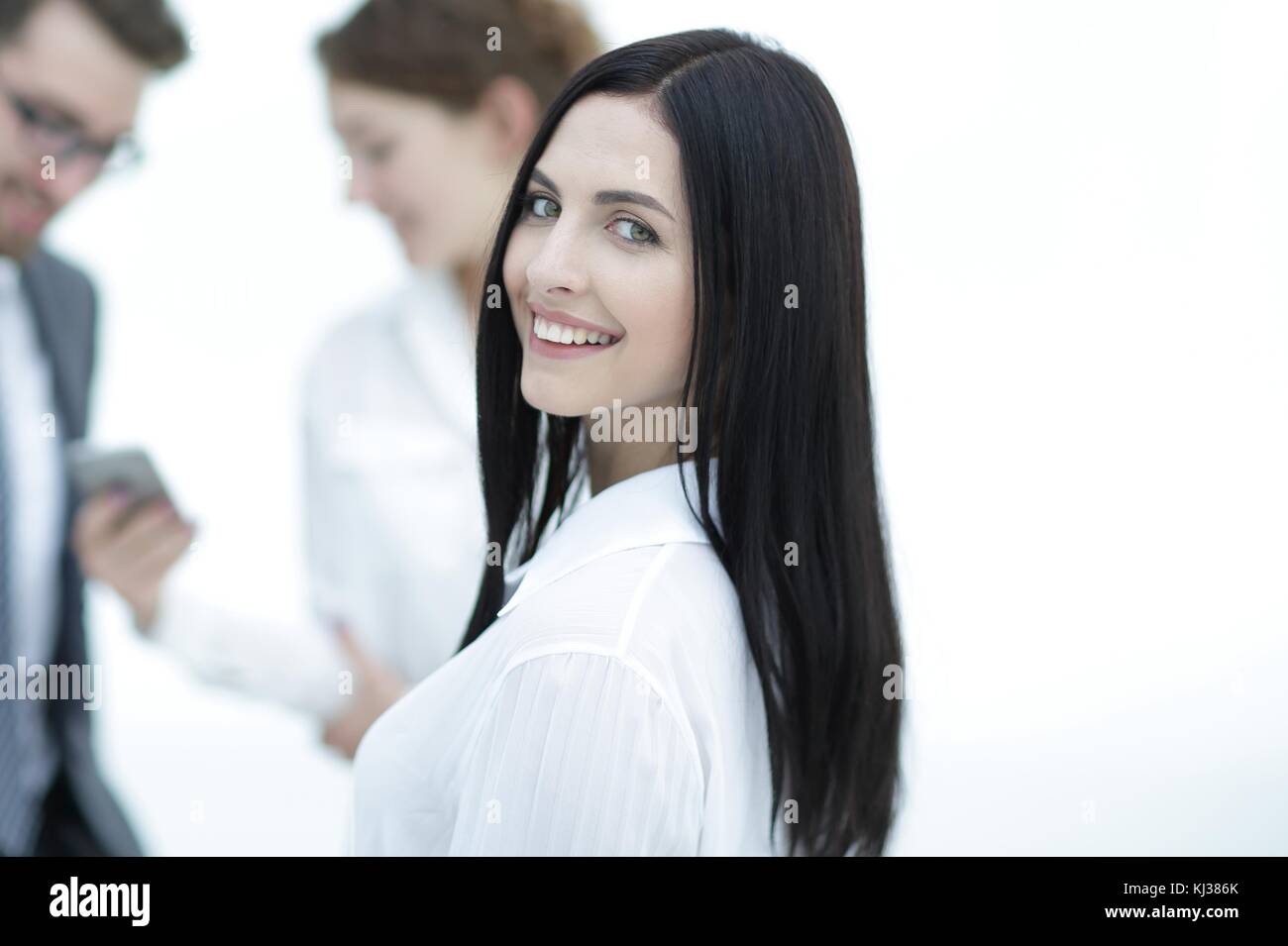 close-up of a beautiful woman manager and co-workers in the office ...
