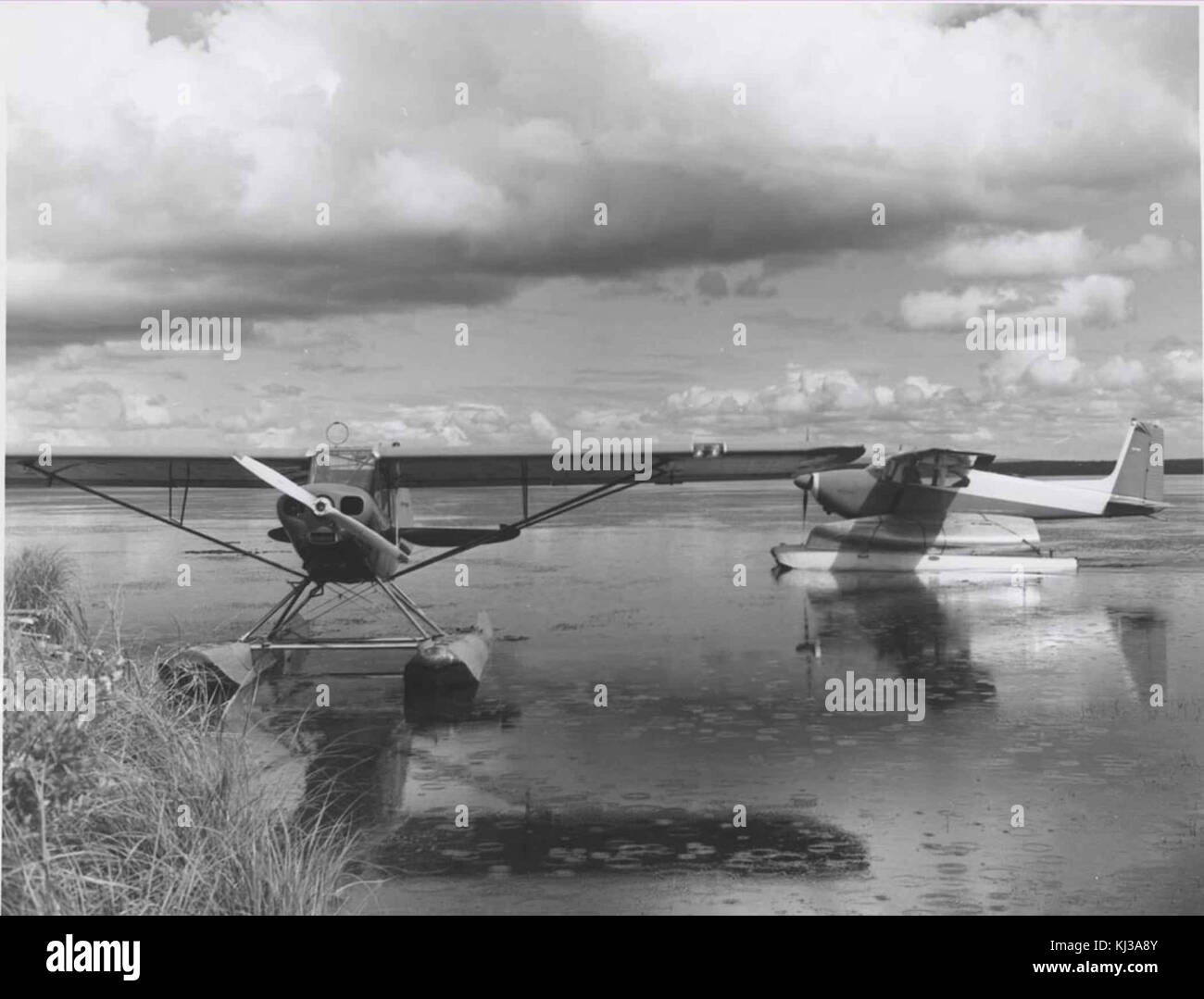 This historical photograph shows two float planes, possibly from the ...