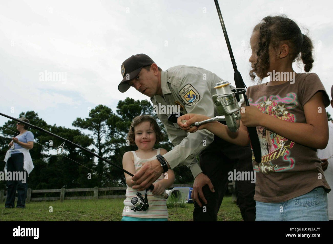 Two little girls fishing hi-res stock photography and images - Alamy