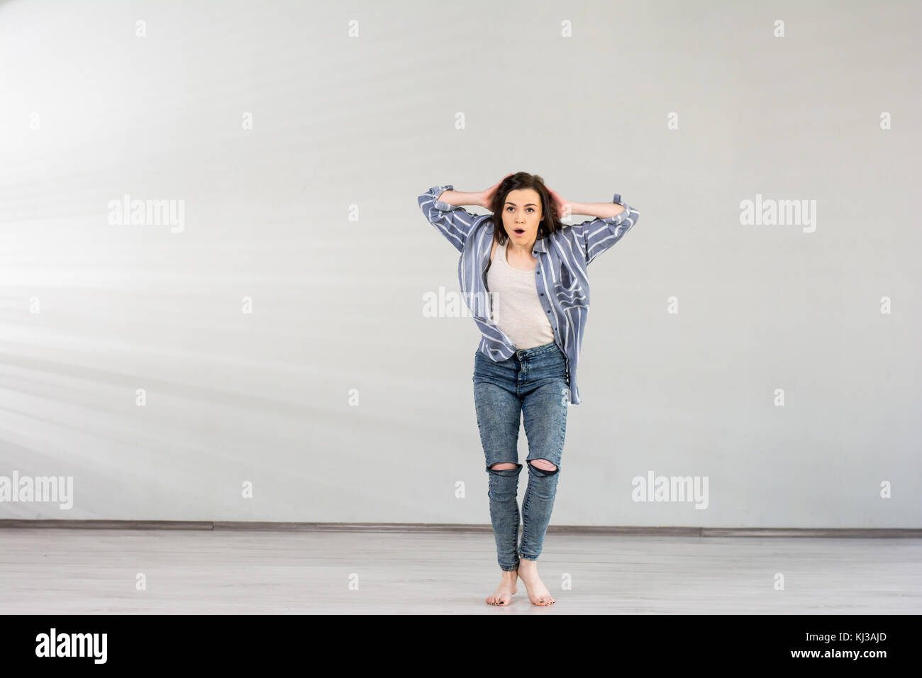 Young pretty dancer posing in studio Stock Photo - Alamy
