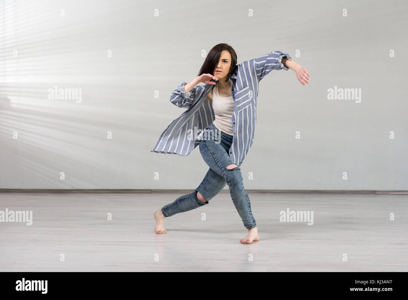 Young pretty dancer in motion Stock Photo - Alamy