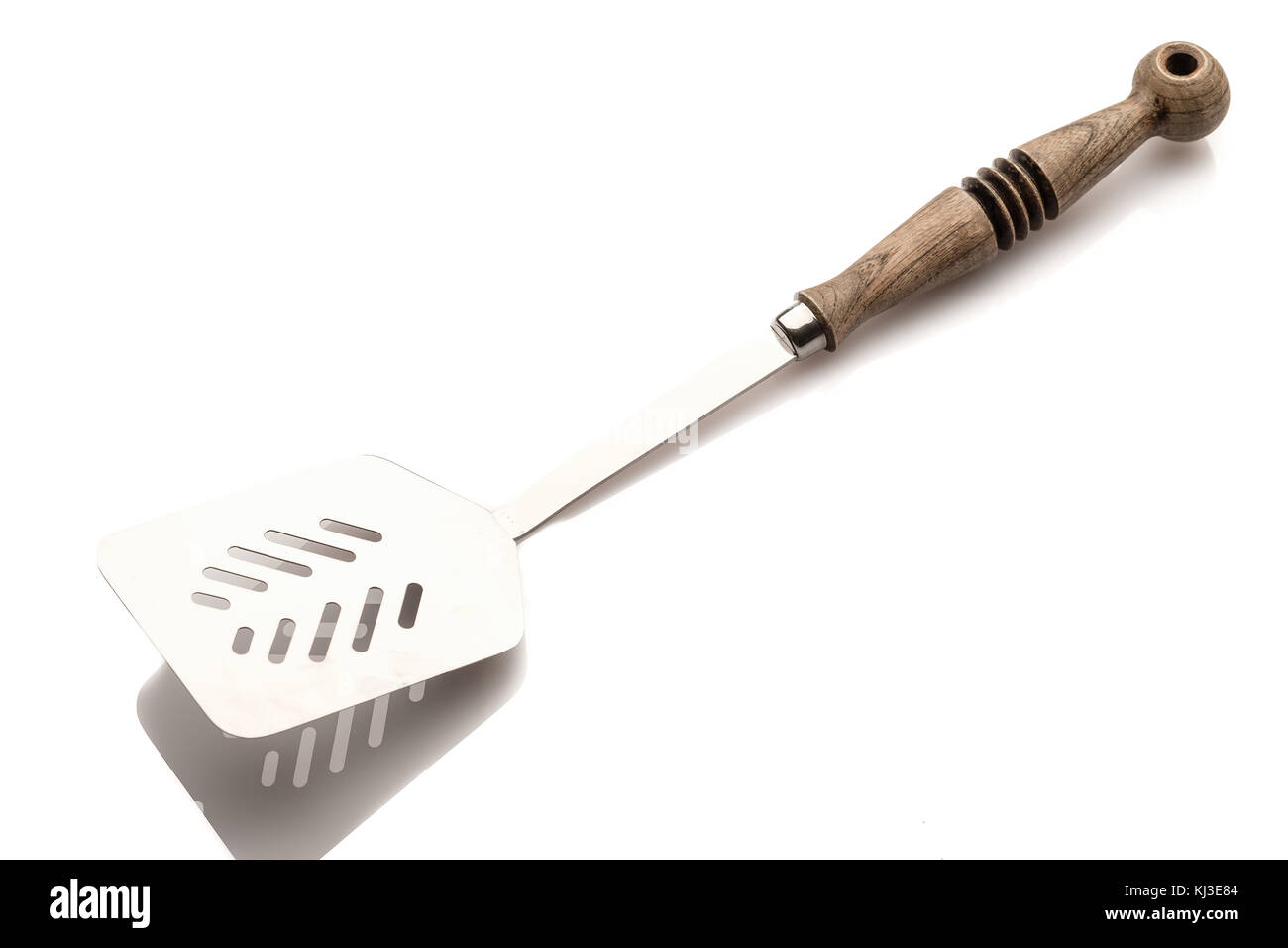 Pan scraper with metal and wooden grip white isolated Stock Photo - Alamy