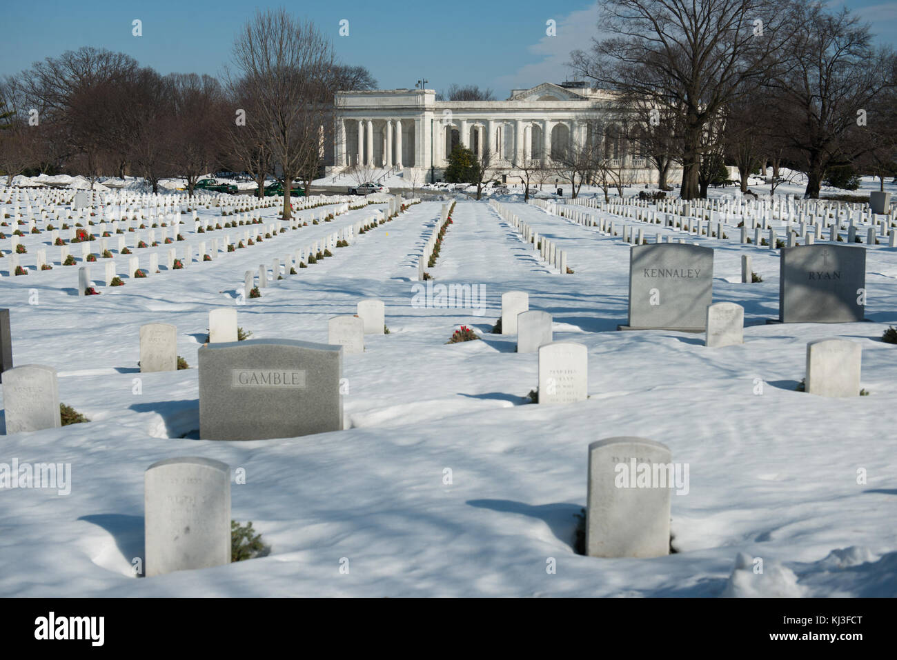 This photograph captures snow at Arlington National Cemetery, providing ...