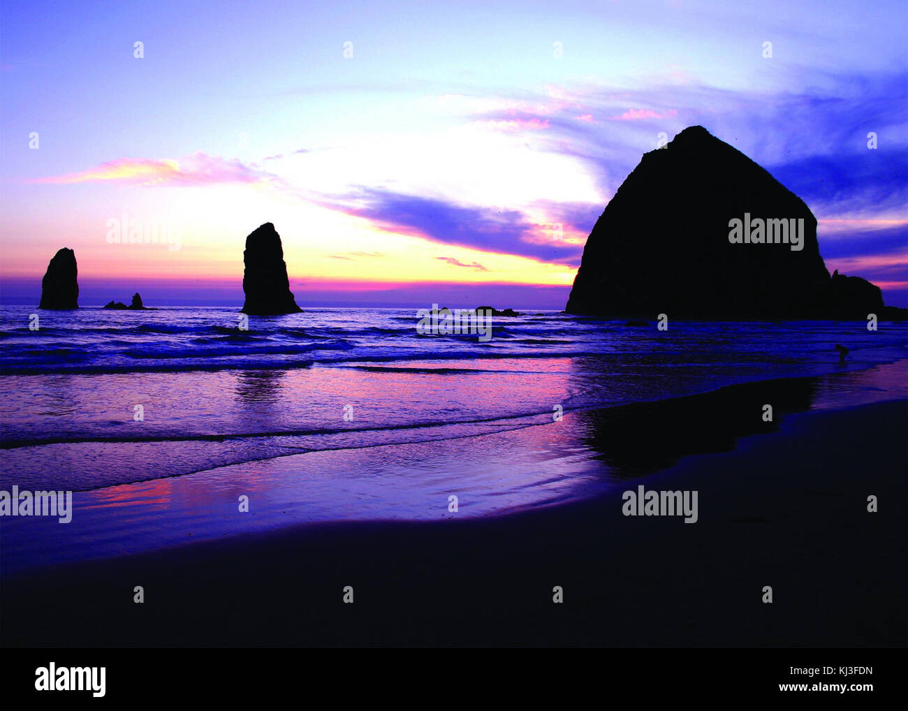 Haystack Rock at sunset Stock Photo - Alamy