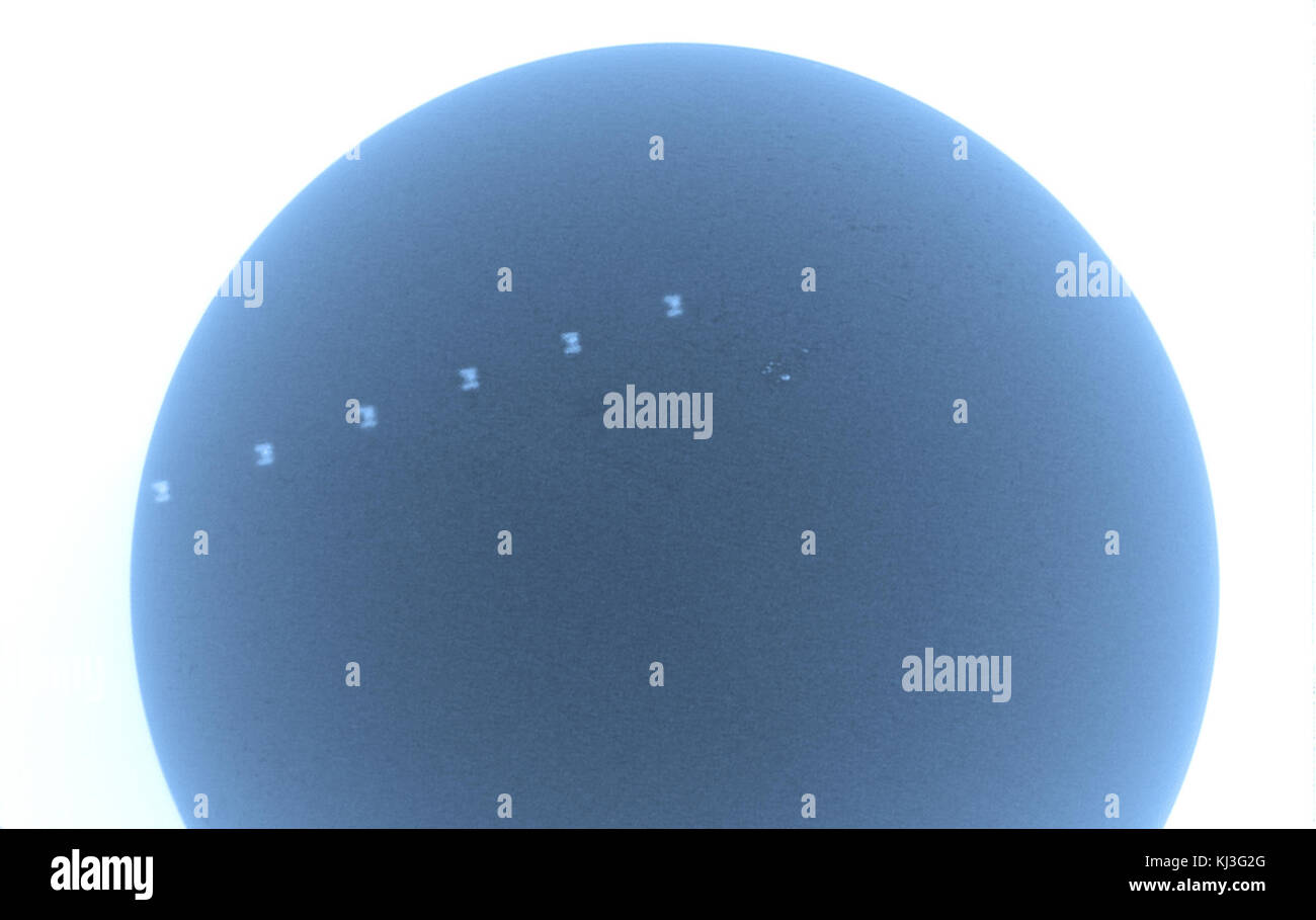 ISS crosses the Sun Inverted Stock Photo - Alamy