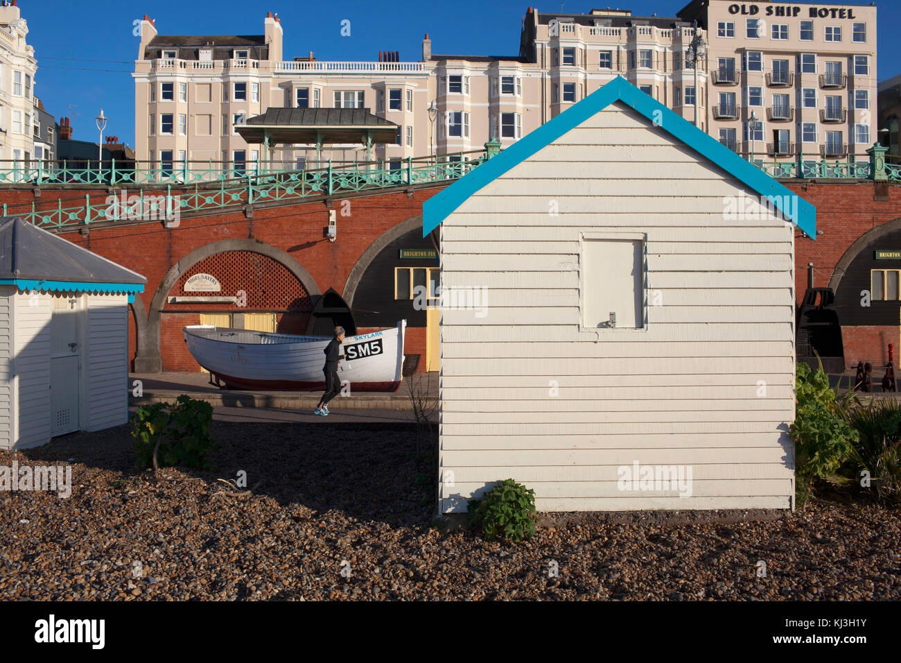 Brighton beach hut and boat Stock Photo - Alamy