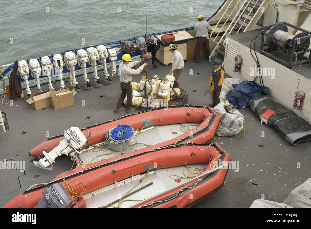 Workers on boat Stock Photo - Alamy